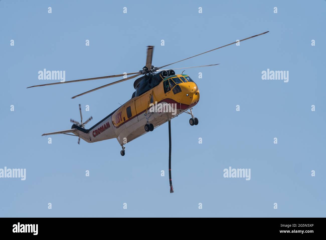 A Sikorsky S-61 fire-fighting helicopter configured for aerial fire ...