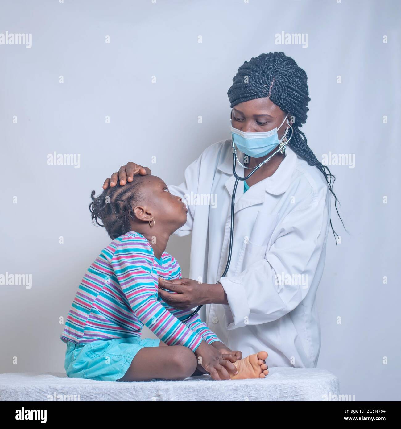 African Woman Exam Doctor Table High Resolution Stock Photography and ...