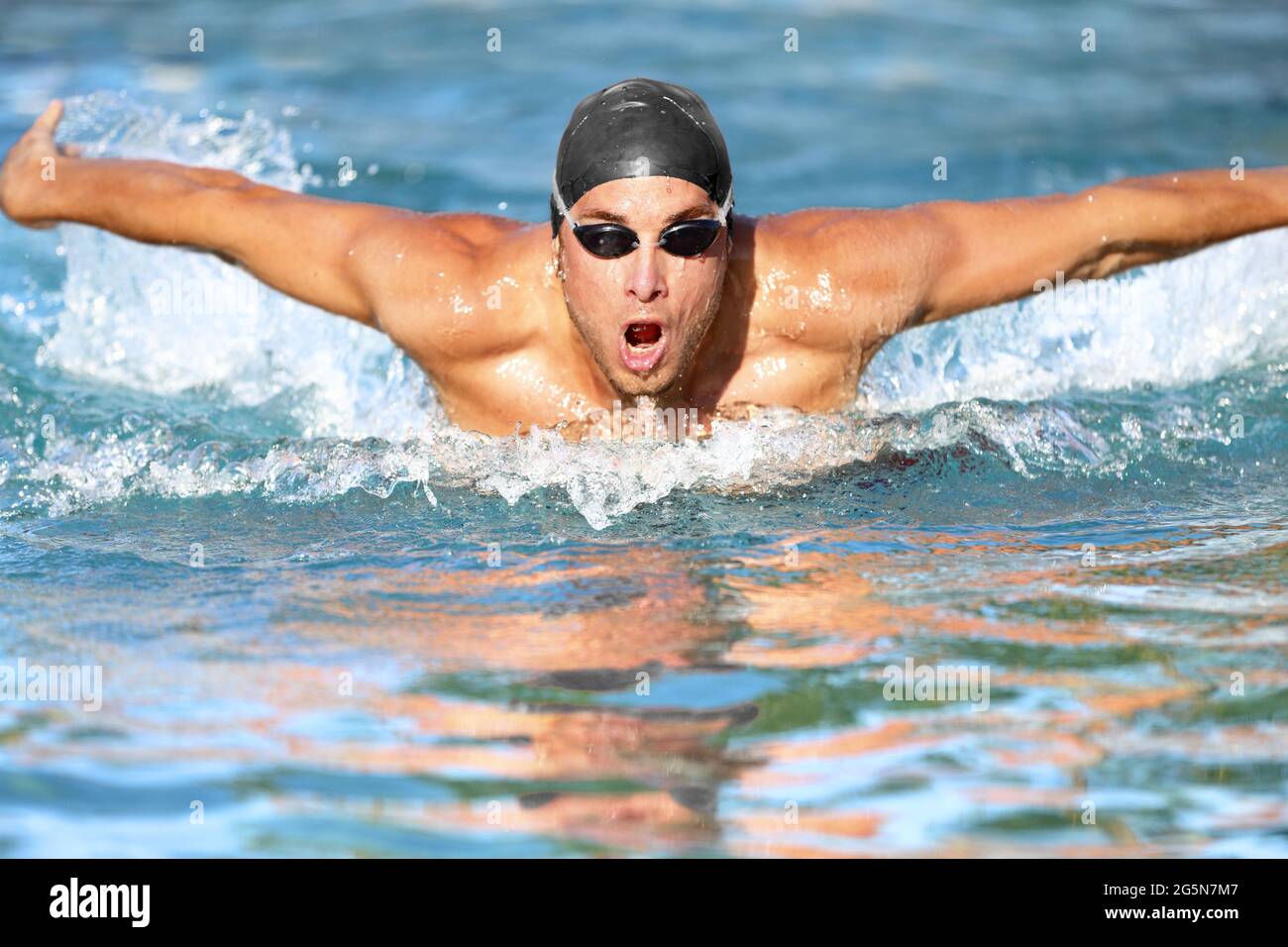 Fit swimmer athlete training in the swimming pool Stock Photo - Alamy