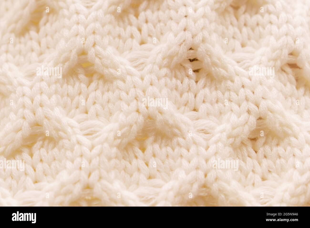Knitted woolen white pattern close-up. handmade plaid top view ...
