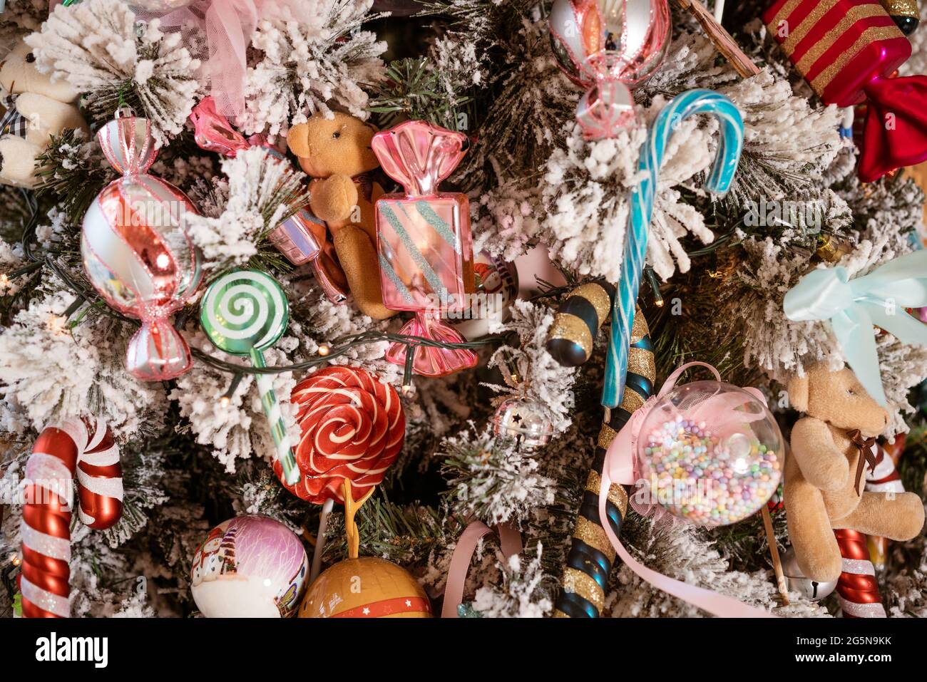 a fragment of a decorated Christmas tree with colorful colorful toys ...