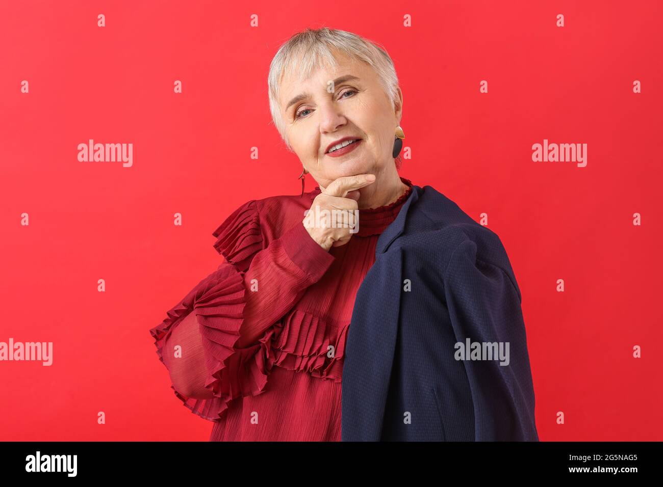 Portrait of stylish senior woman on color background Stock Photo - Alamy