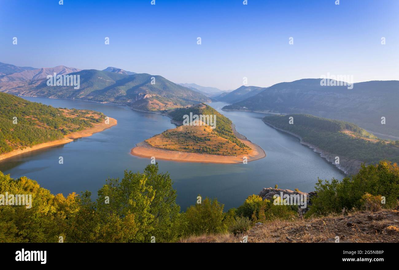 Landscape with a meander of a river against the backdrop of mountains ...