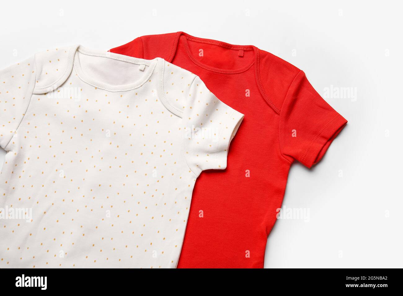 Baby clothes on white background Stock Photo - Alamy