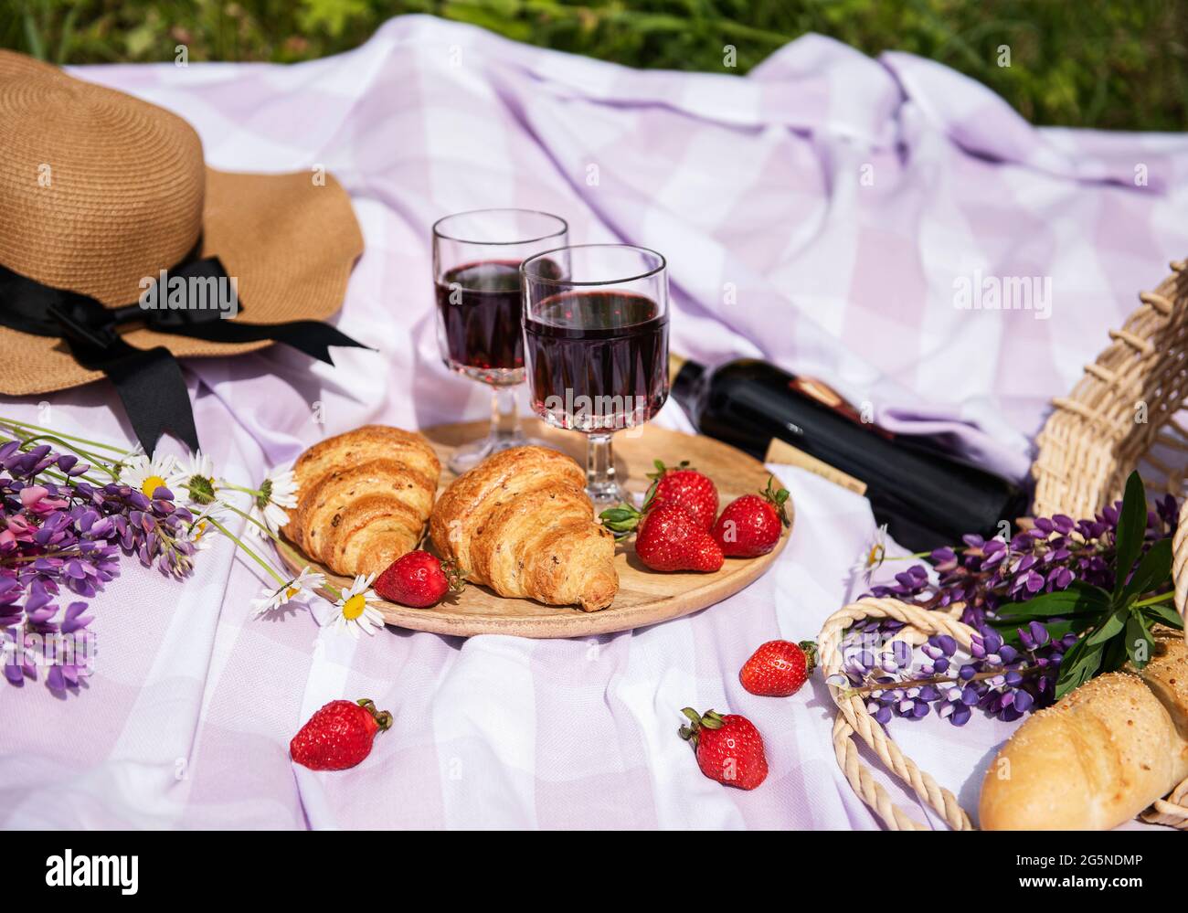 Romantic picnic scene on summer day. Outdoor picnic with wine and a ...