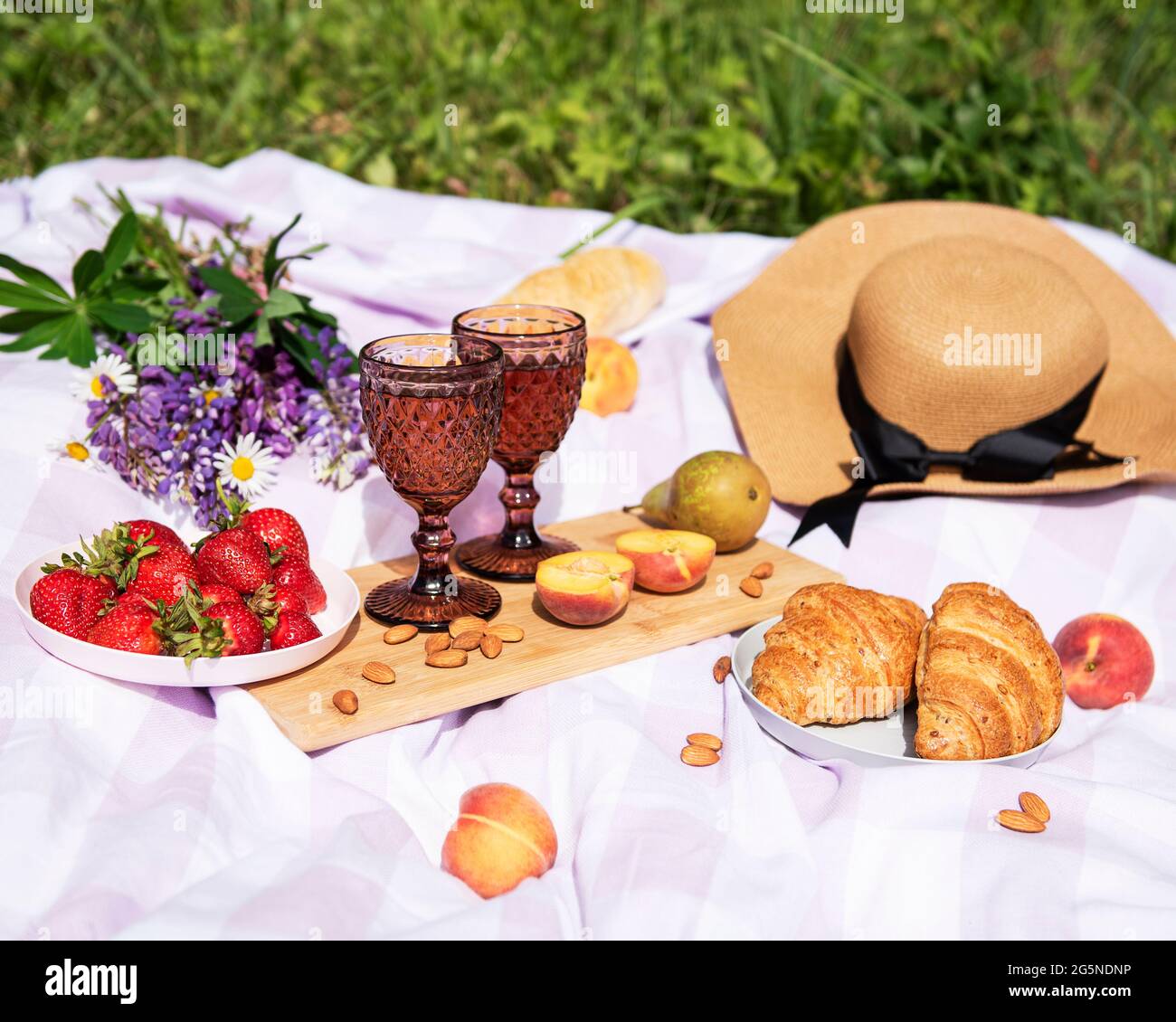 Romantic picnic scene on summer day. Outdoor picnic with wine and a ...
