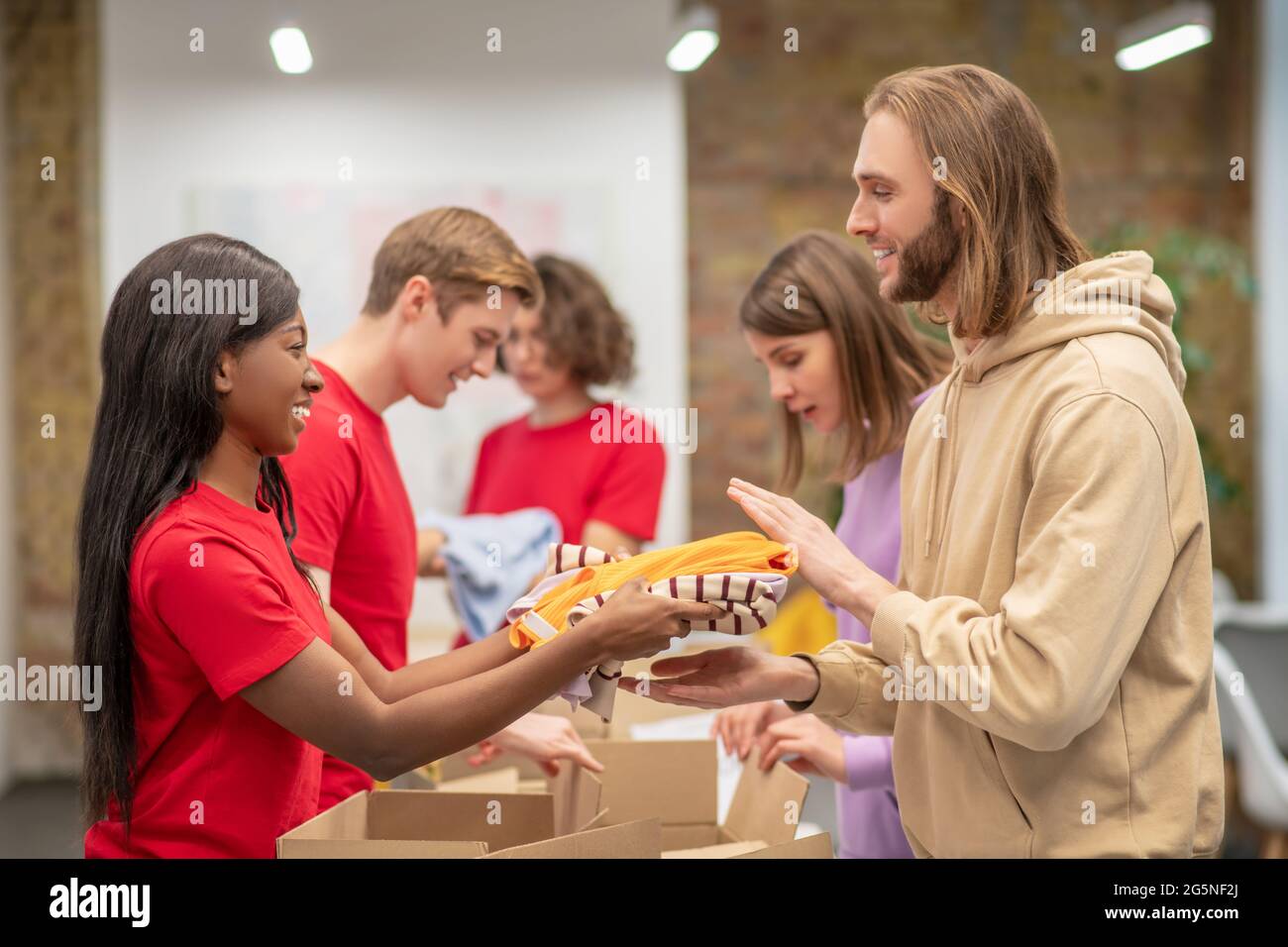 People receiving hi-res stock photography and images - Alamy