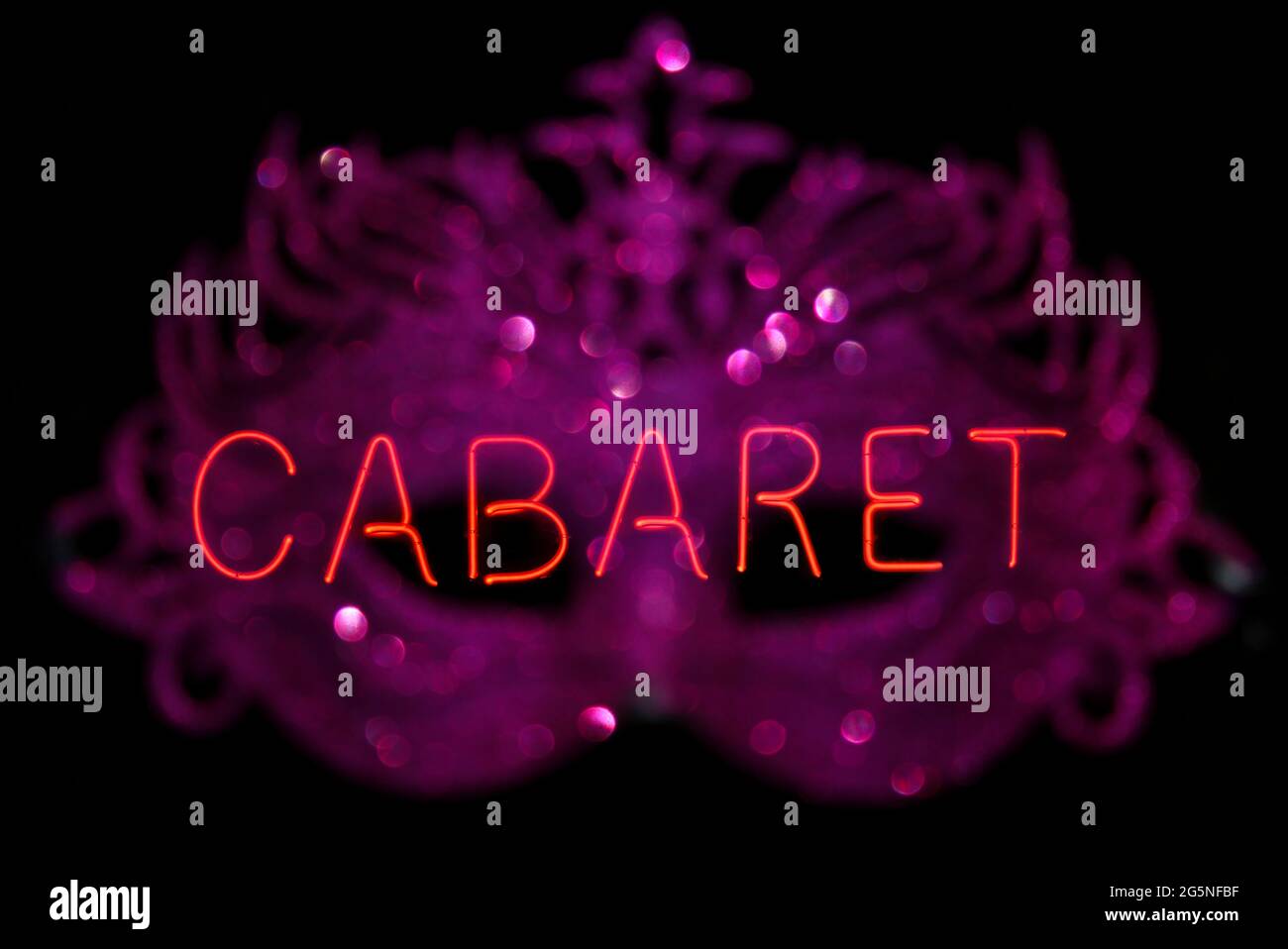 Vintage Neon Cabaret Sign With Bokeh Carnival Mask Stock Photo - Alamy
