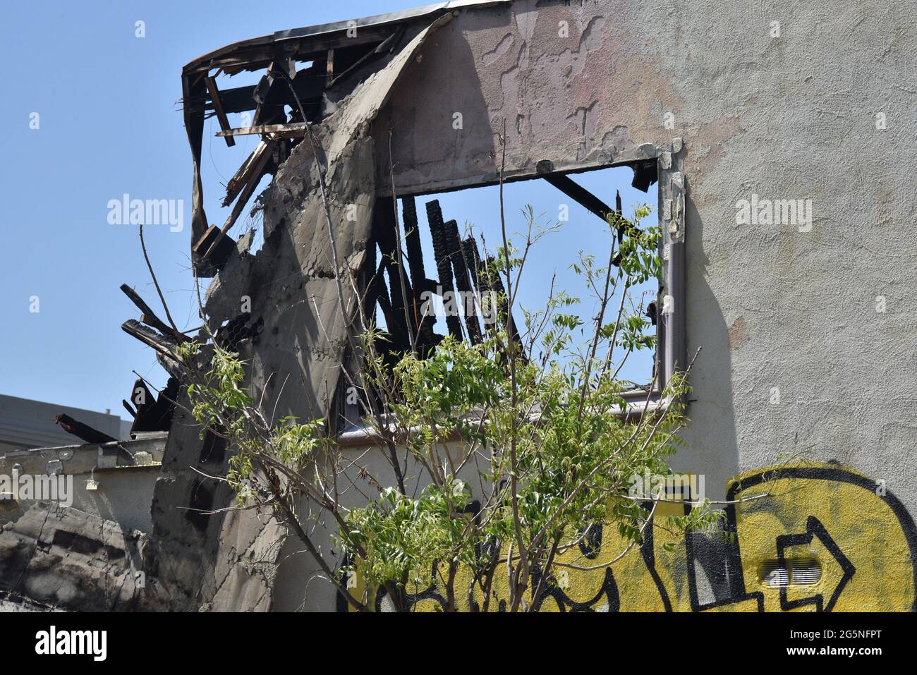Remains of a falling apart burned office building Stock Photo - Alamy