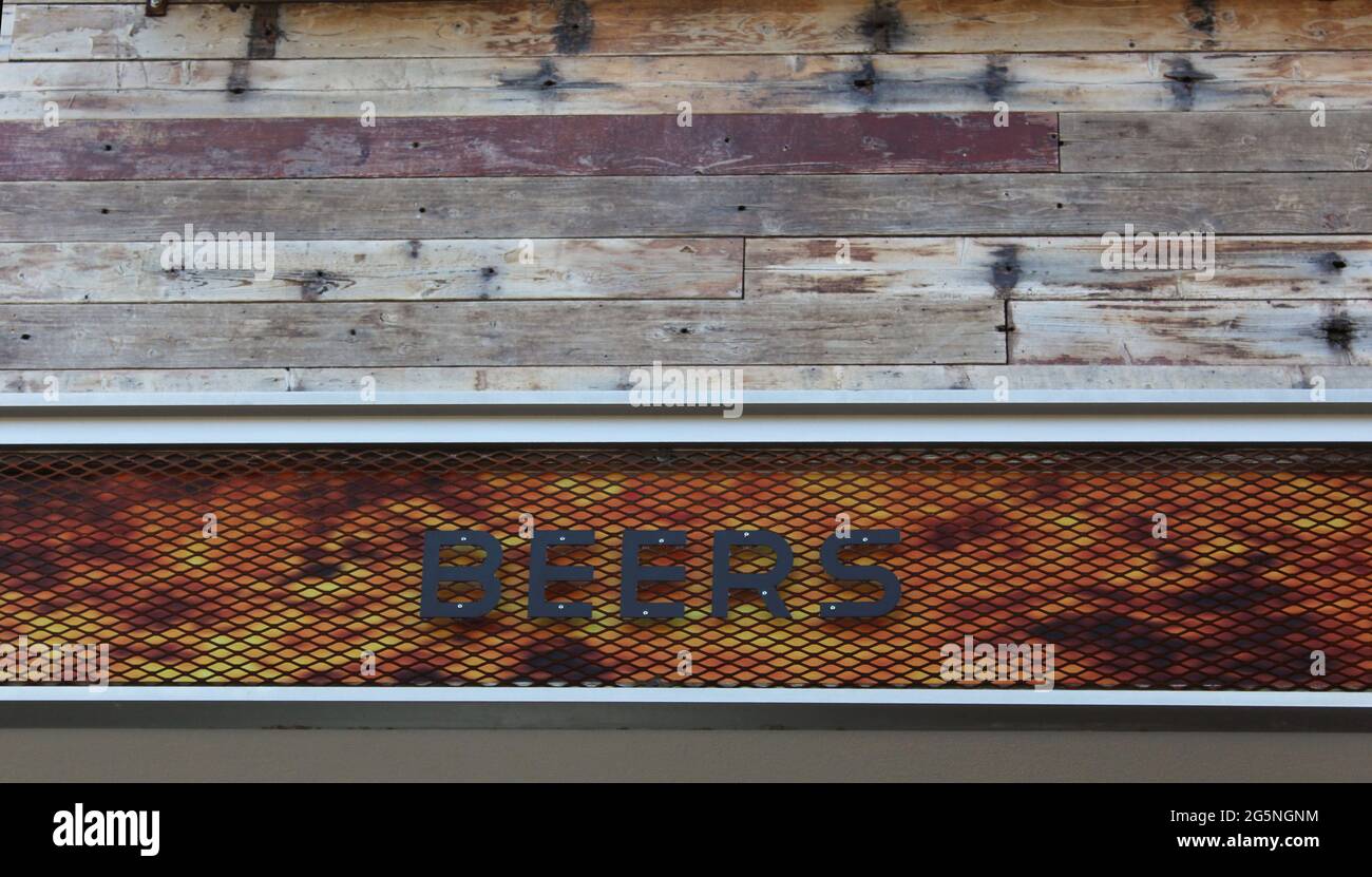 Beer sign on rustic building, Local Restaurant Sign Stock Photo - Alamy