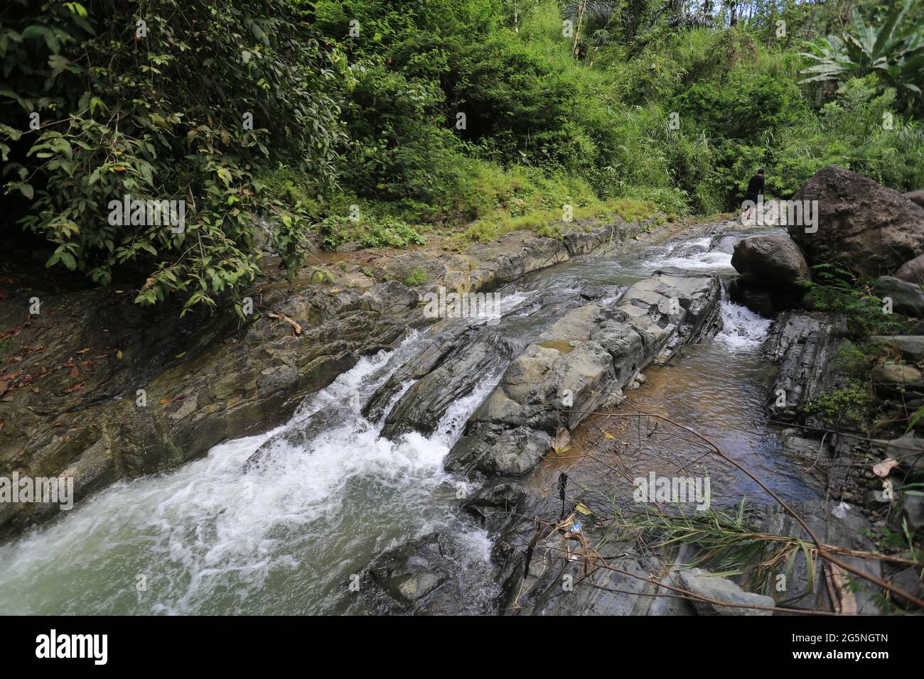 River and water falls runs on sediment rocks at West Java Indonesia ...