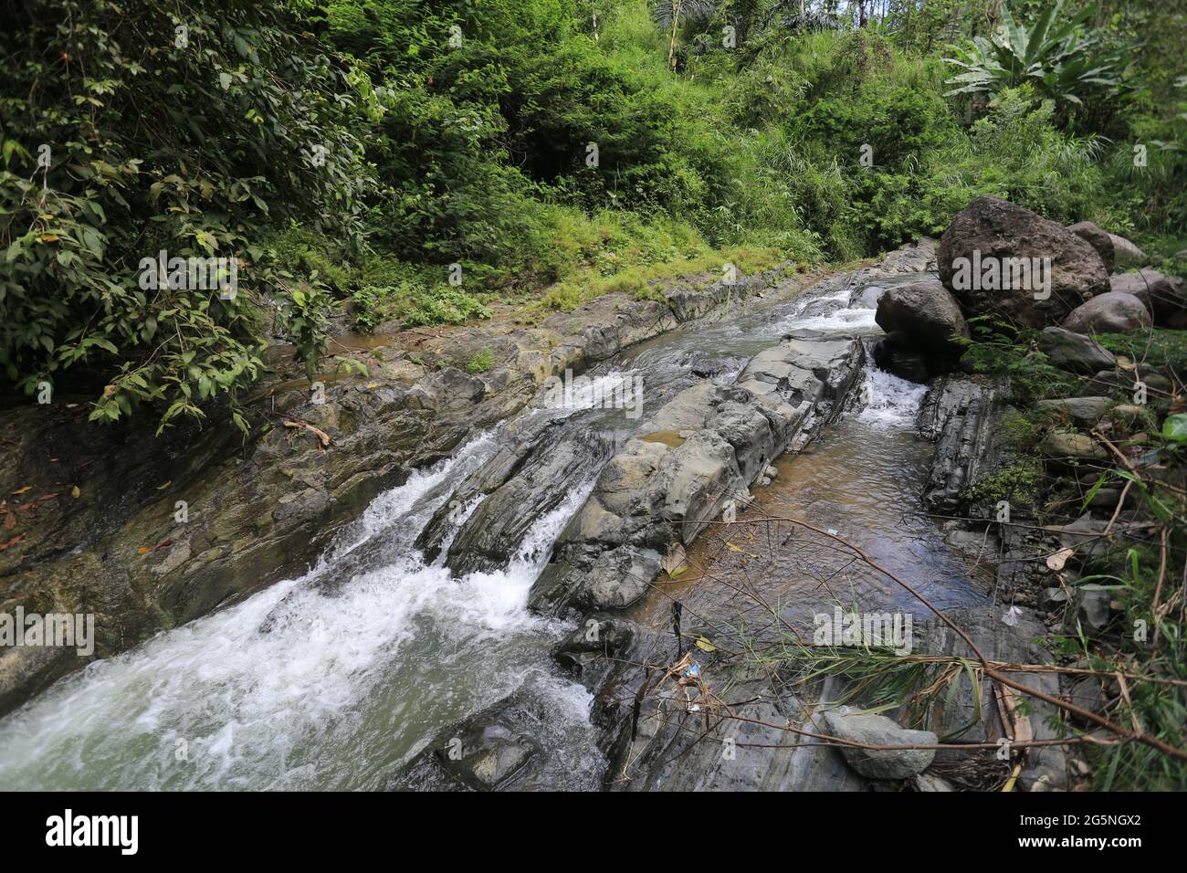 River and water falls runs on sediment rocks at West Java Indonesia ...