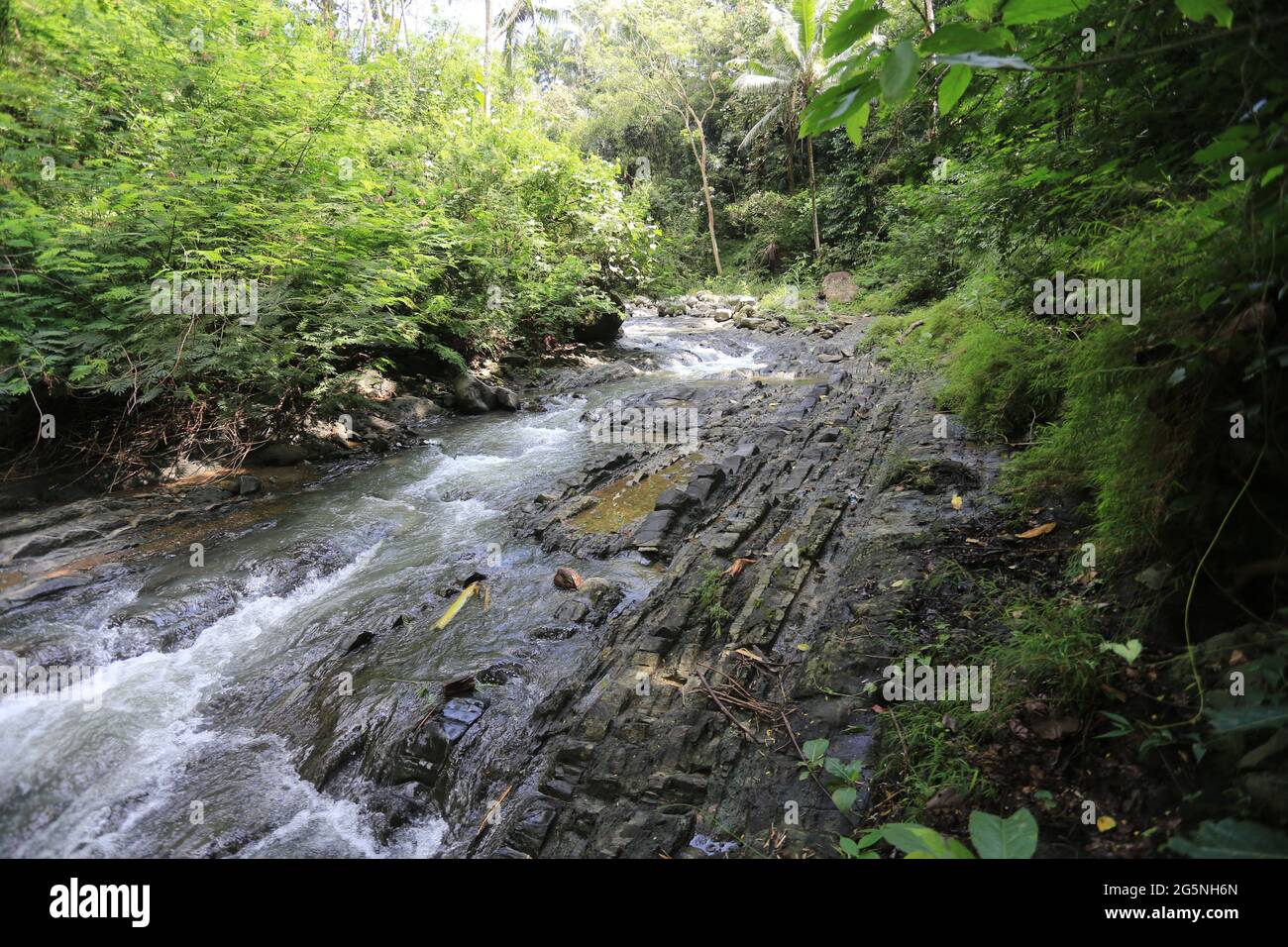 River and water falls runs on sediment rocks at West Java Indonesia ...