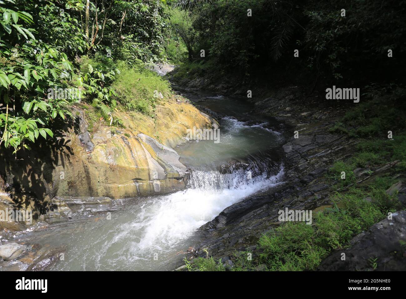 River and water falls runs on sediment rocks at West Java Indonesia ...