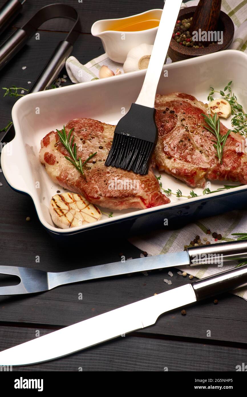 Grilled roated beef steaks in baking dish Stock Photo - Alamy