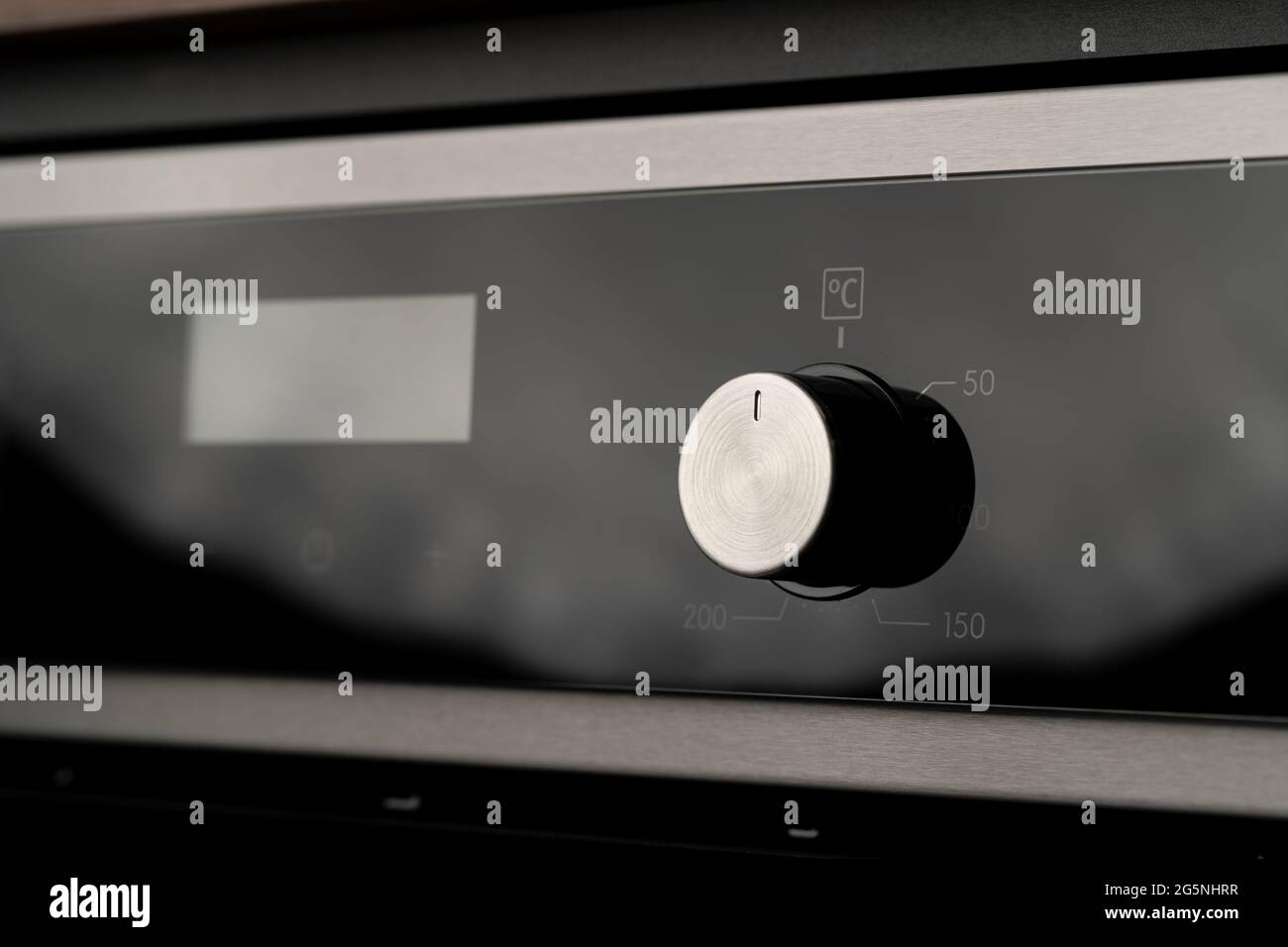 Modern oven mode control button close up Stock Photo - Alamy