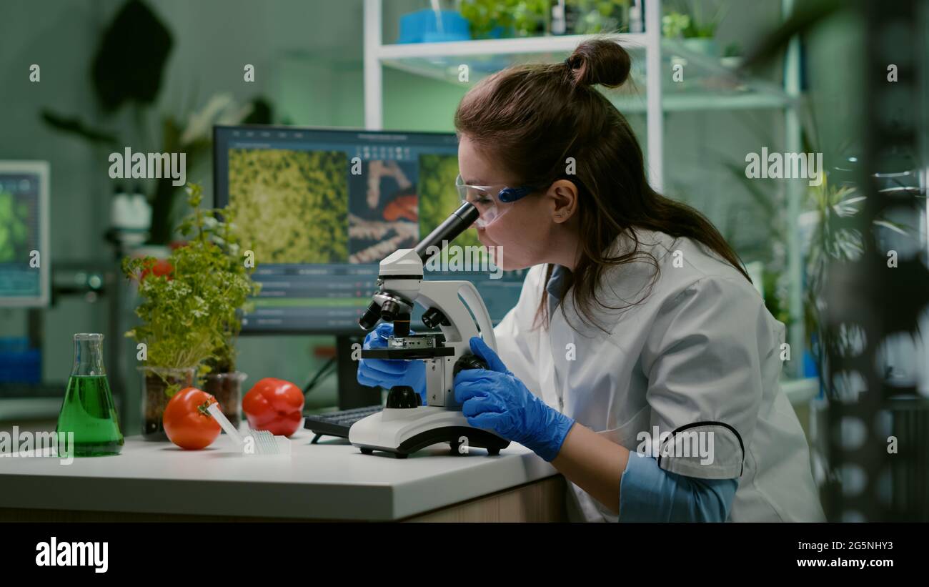 Portrait of biologist scientist in white coat working in expertise ...