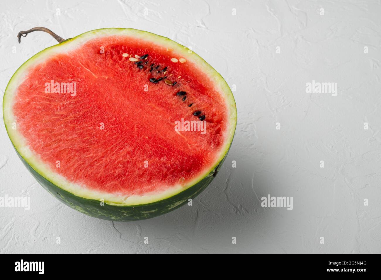 Fresh cut watermelon set, on white stone table background, with copy ...