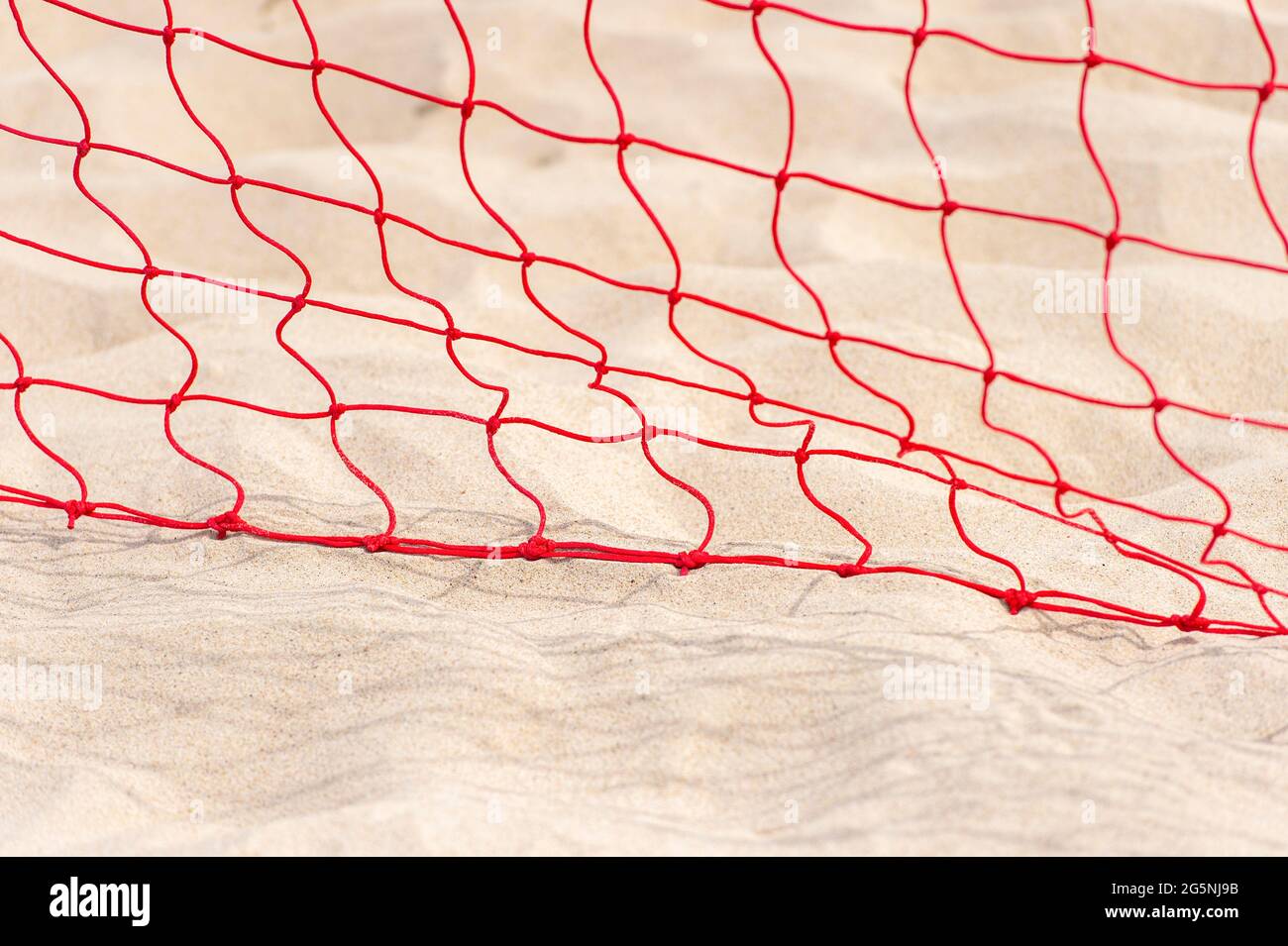 Beach volleyball and beach tennis net on the background of sand. Summer ...