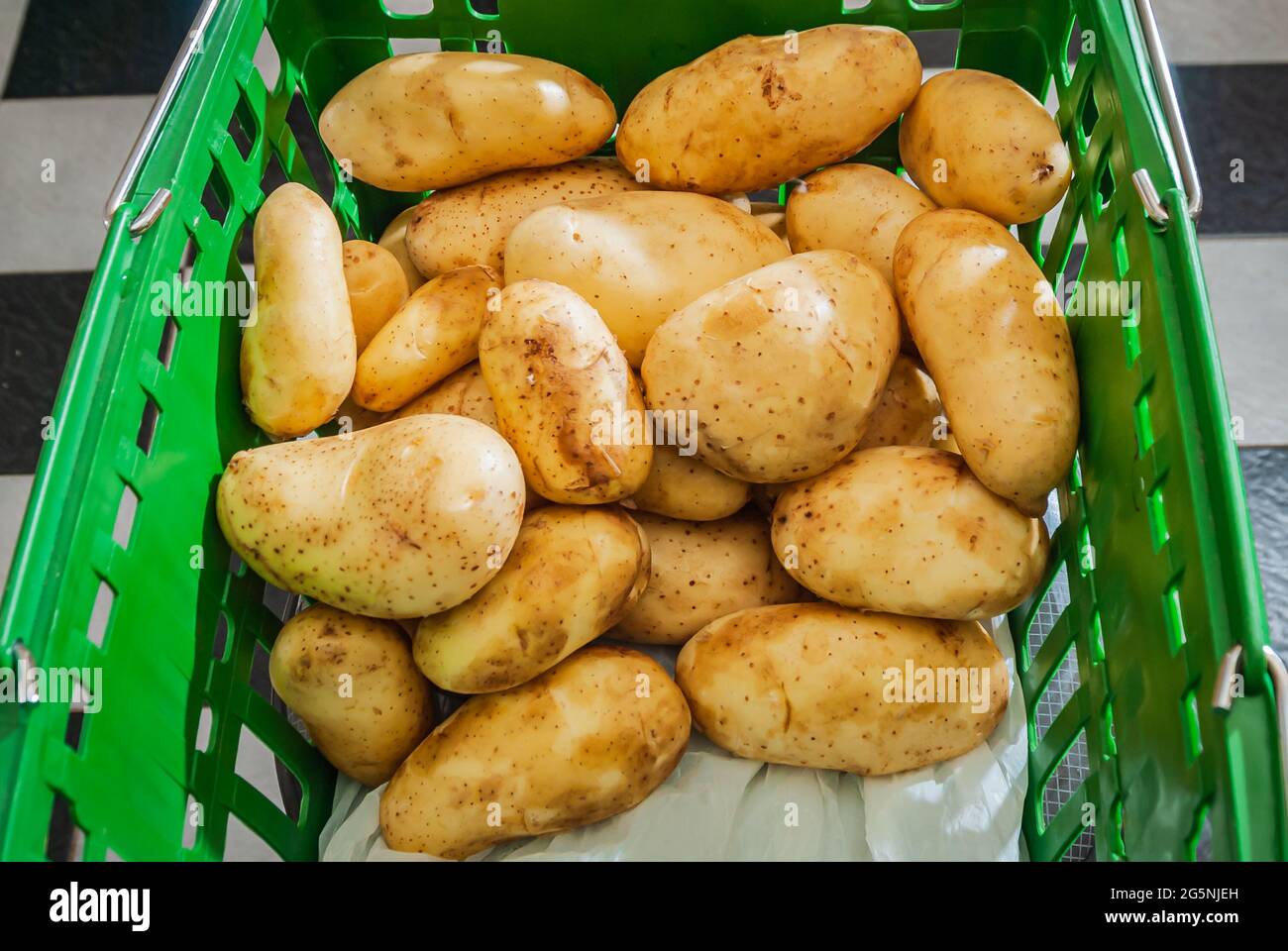 Pile of fresh Raw organic potatoes on green market basket. Farm fresh ...