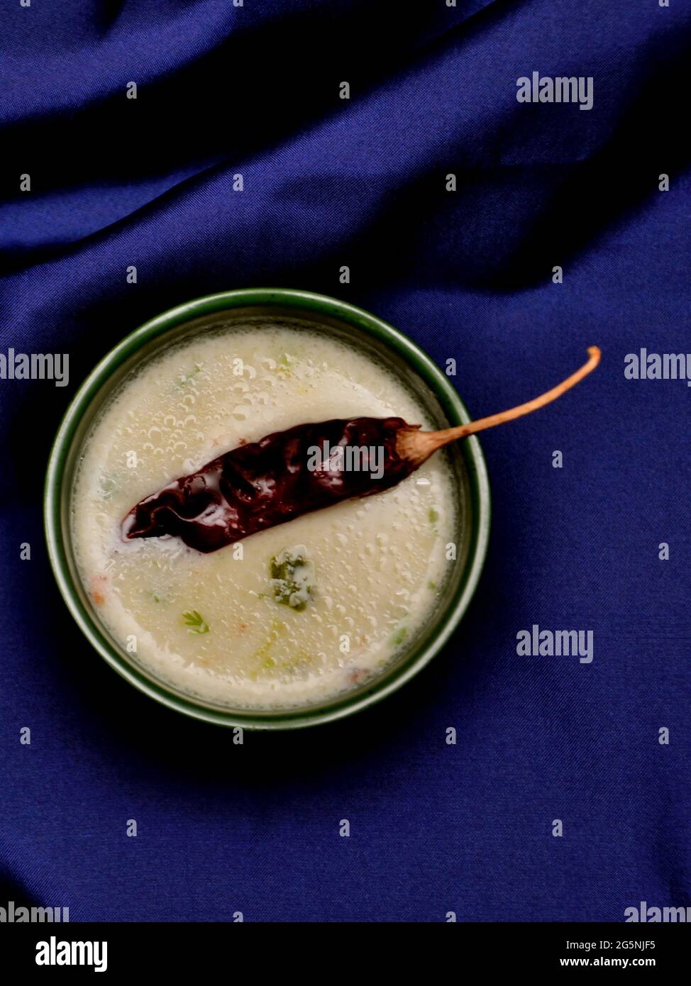 Kadhi or kadi, is an authentic Indian food, looks like Curry which is ...