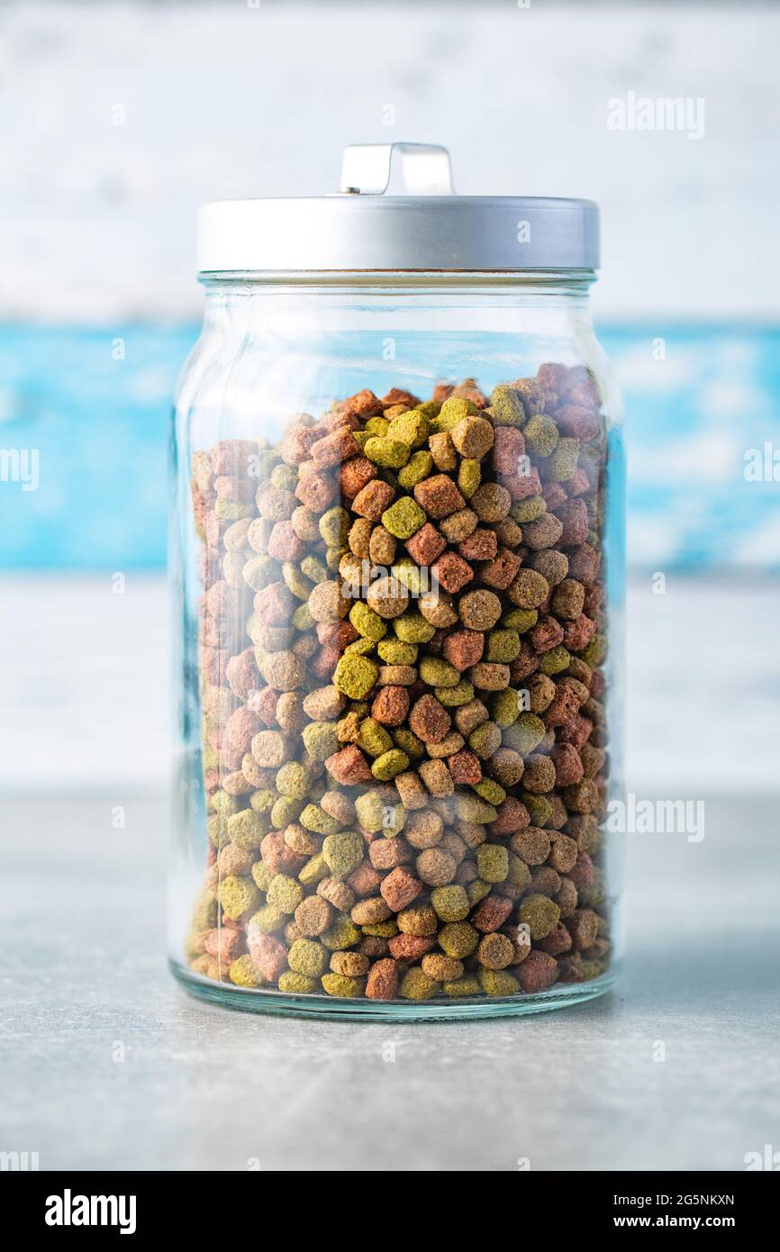Dry kibble animal food. Dried food for cats or dogs in jar Stock Photo ...