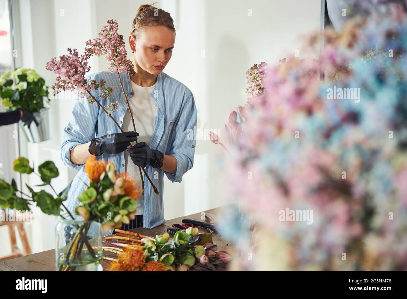 Professional young woman florist hi-res stock photography and images ...