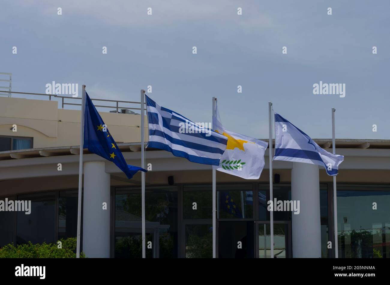 Four national flags with symbols of the European Union, Greece, Cyprus ...