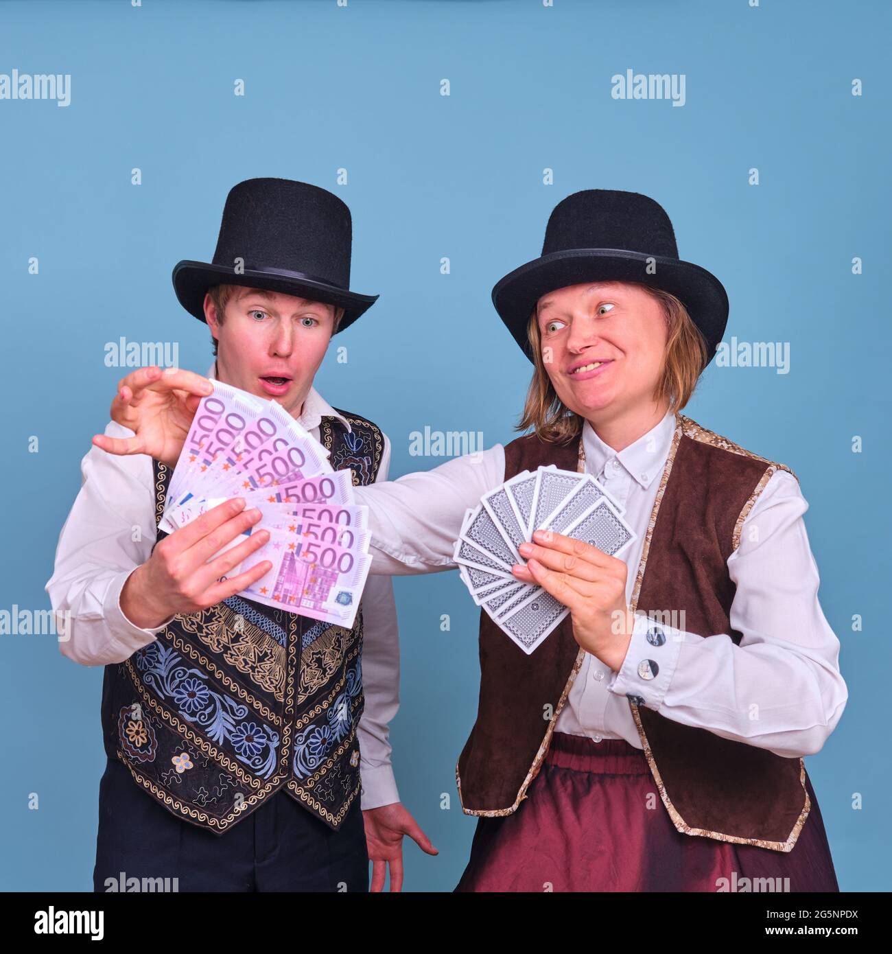 Actors man and woman with euro money in hands on blue background Stock ...