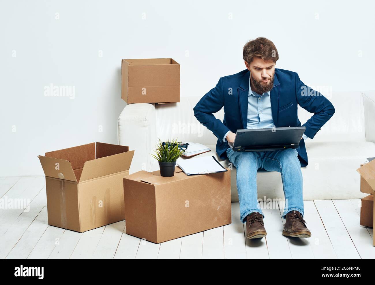 manager packs things from office new place of work Stock Photo - Alamy