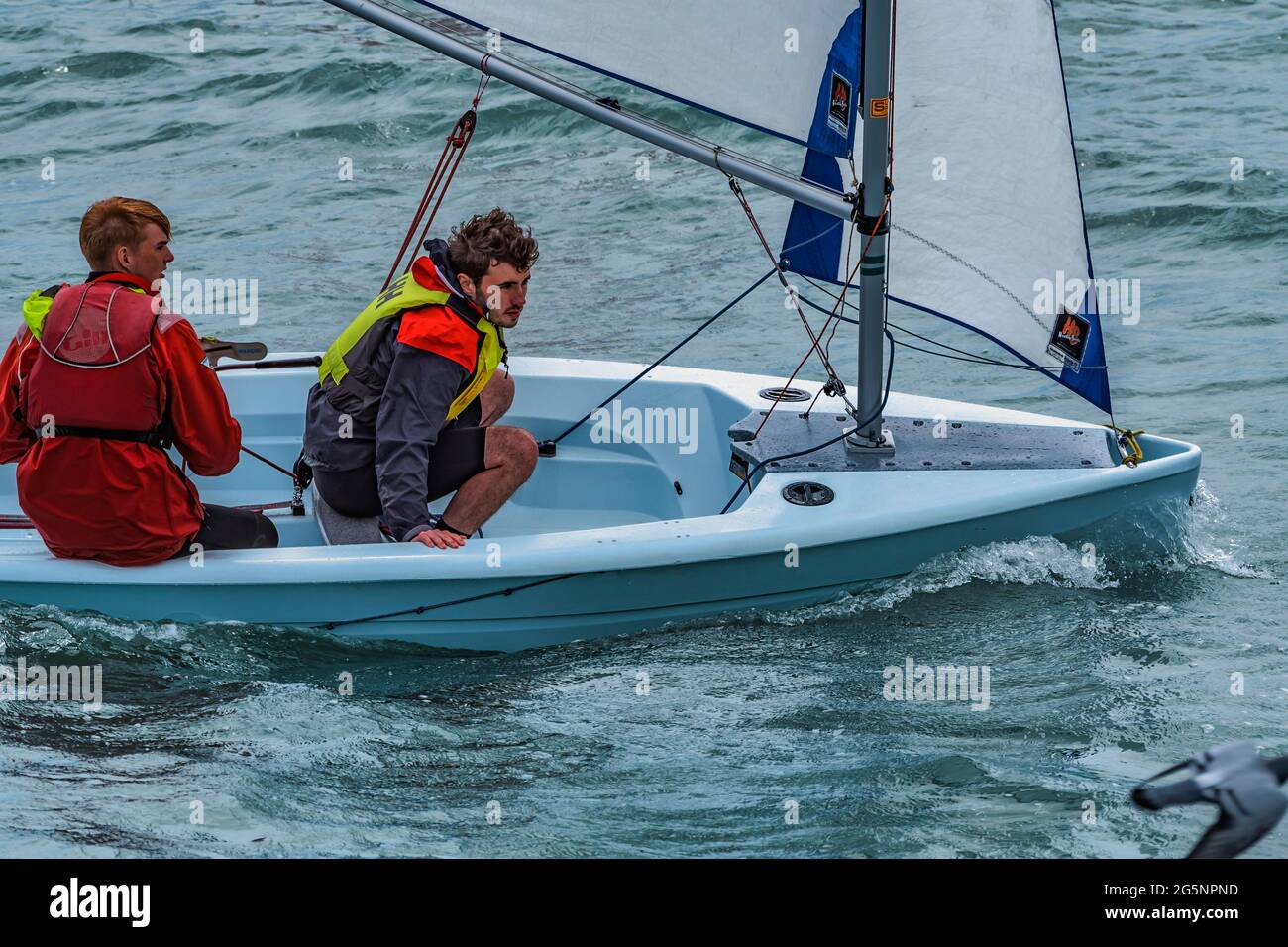 Sailing dinghy sails during sail club regatta near Greystones, Irish ...