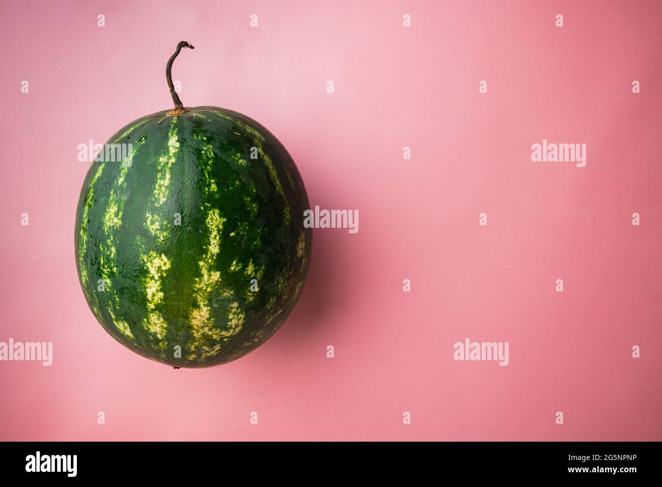Single watermelon set, on pink textured summer background Stock Photo ...