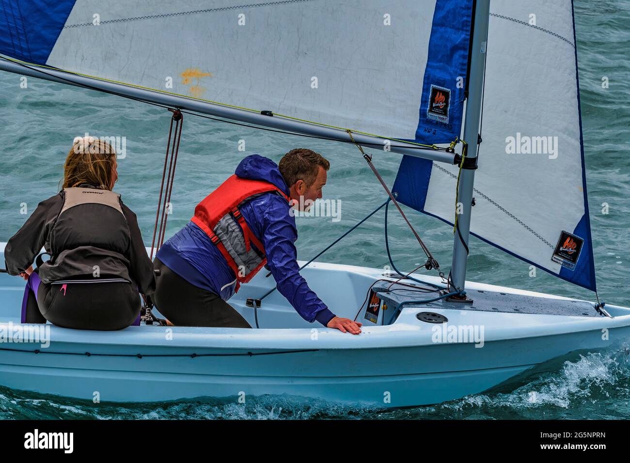 Sailing dinghy sails during sail club regatta near Greystones, Irish ...
