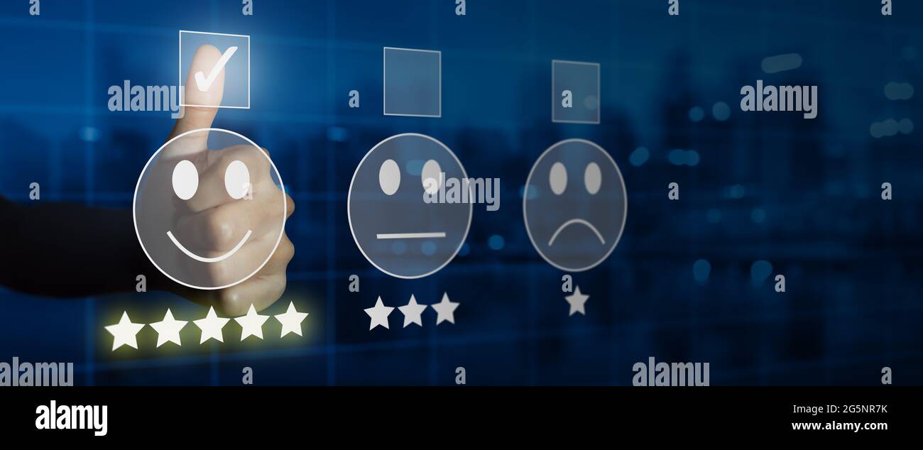 Businessman giving rating with smiley face emoticon on virtual touch ...