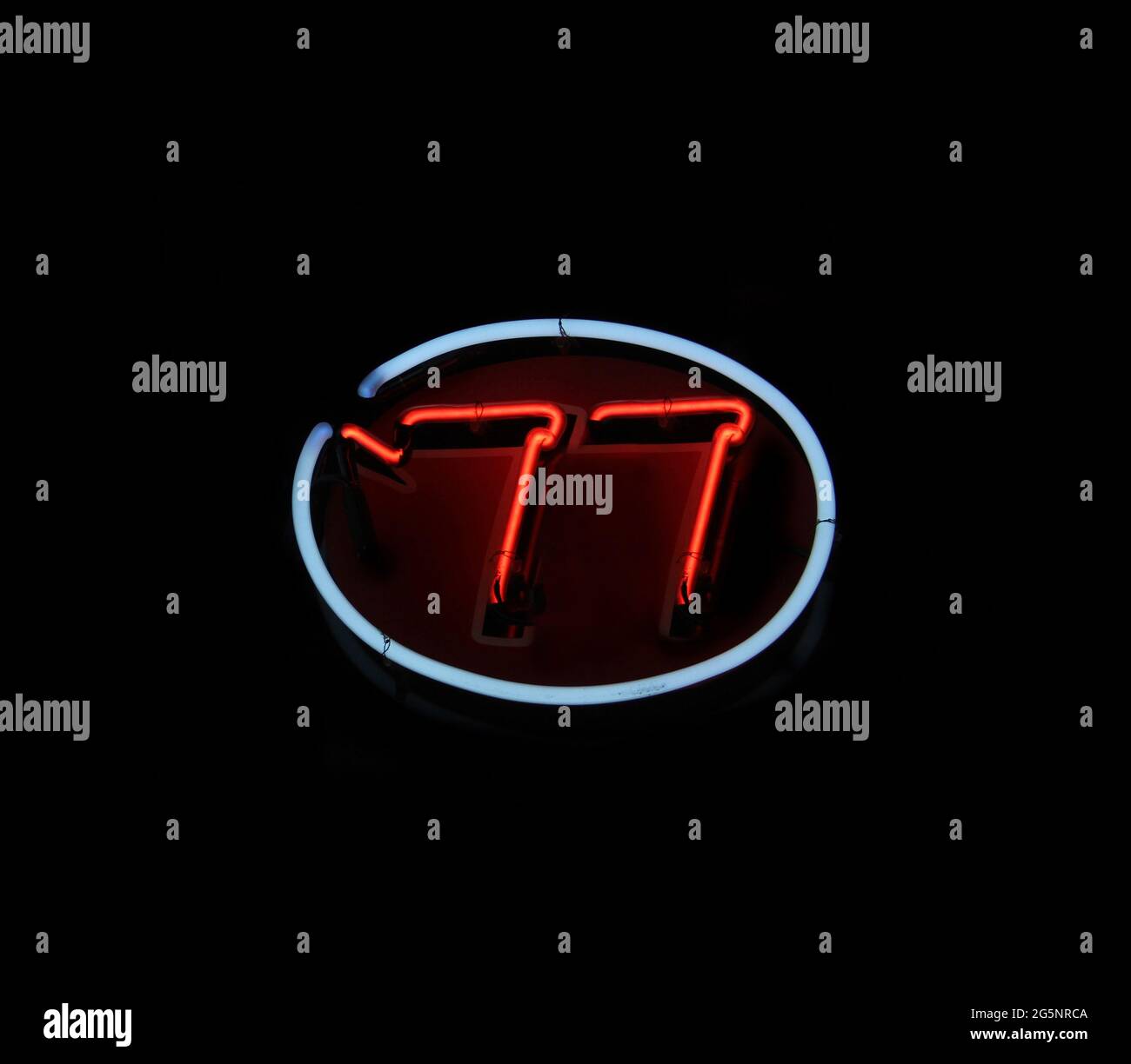 Vintage Neon 77 Sign on Restaurant Window Stock Photo - Alamy