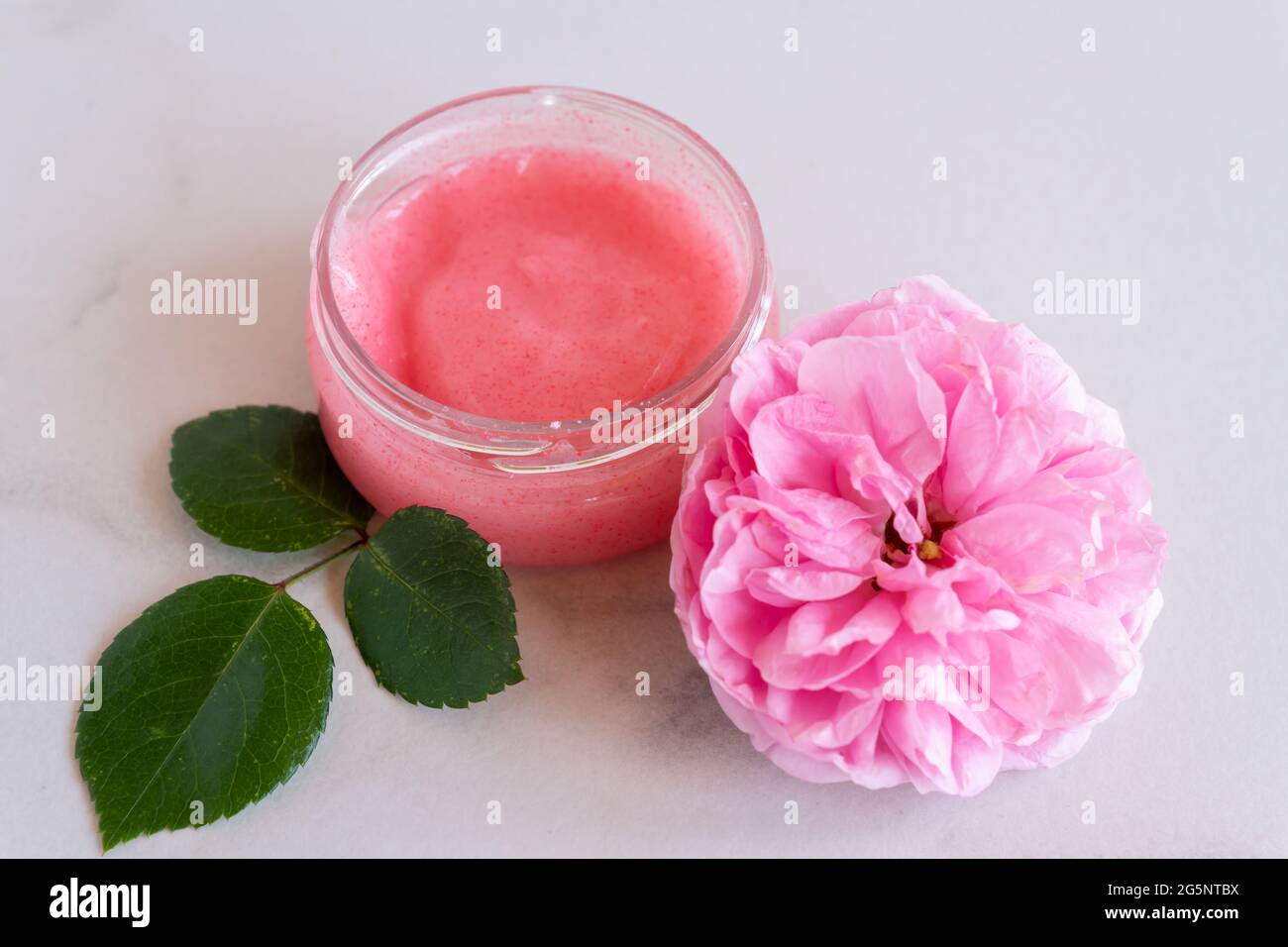 Hygiene bath product. Body, face rose scrub with blooming pink rose ...