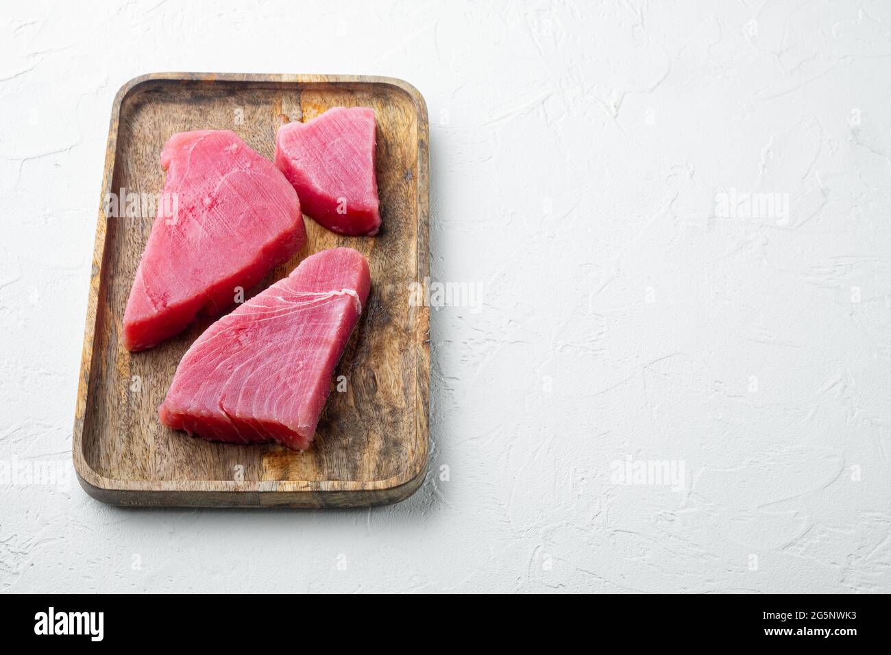 Raw tuna steak, fresh red tuna fish fillet set, on wooden tray, on ...