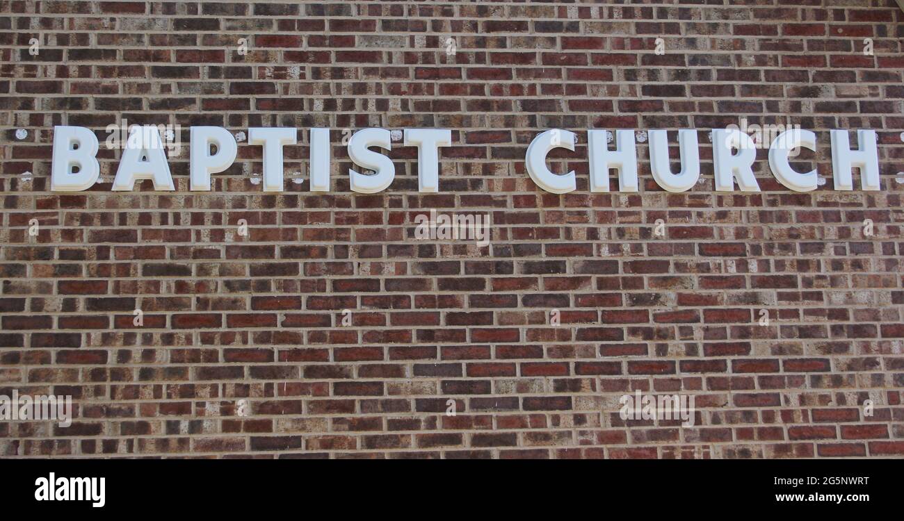 Brick Wall With Baptist Church Sign Stock Photo - Alamy