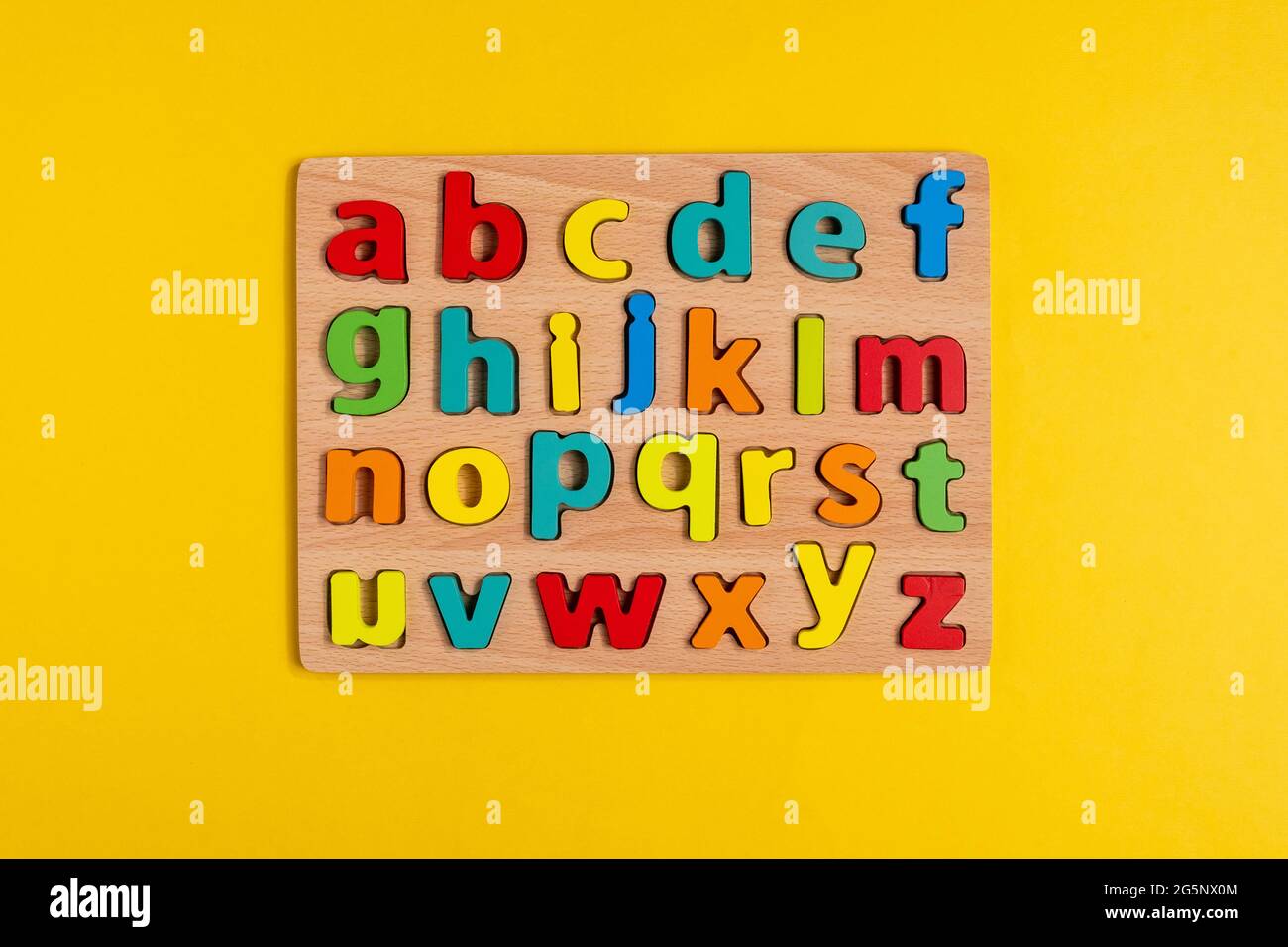 Learning letters. Website, video blog Yellow background Stock Photo - Alamy