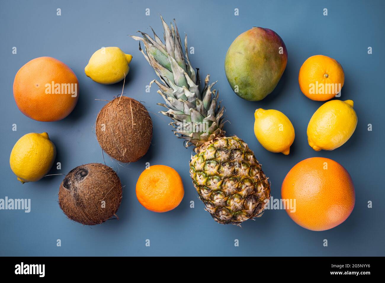 Fresh fruits tropical composition set, on blue textured summer ...
