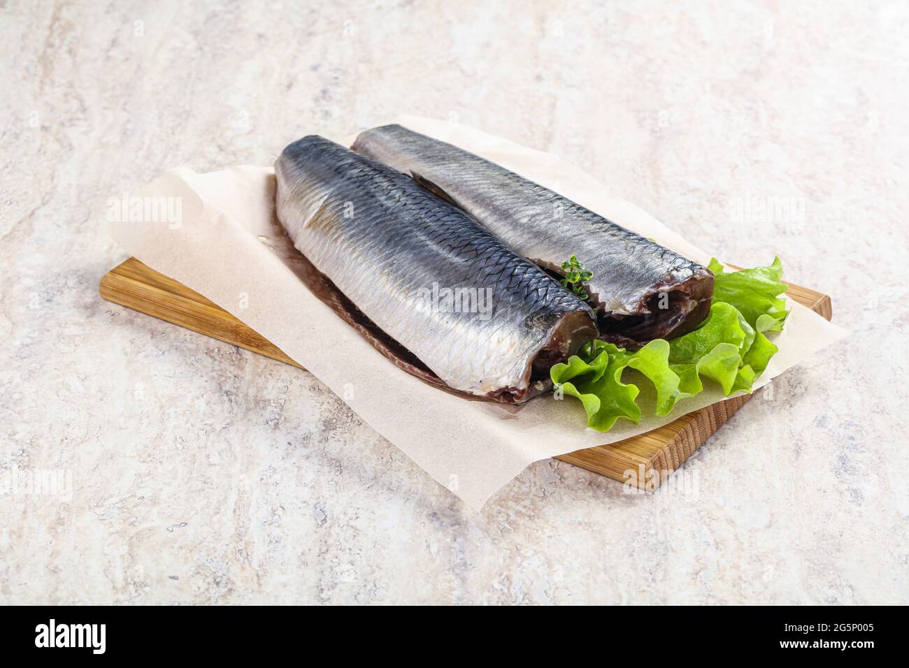 Marinated Herring fillet with skin for cooking Stock Photo - Alamy