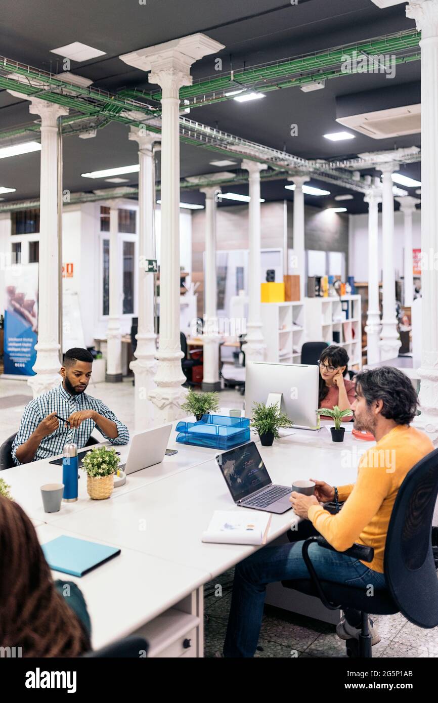 Co workers working together hi-res stock photography and images - Alamy
