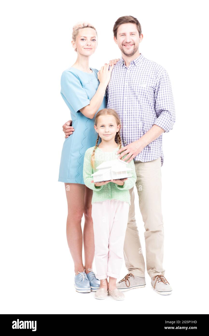 Vertical full length shot of modern family with little daughter ...