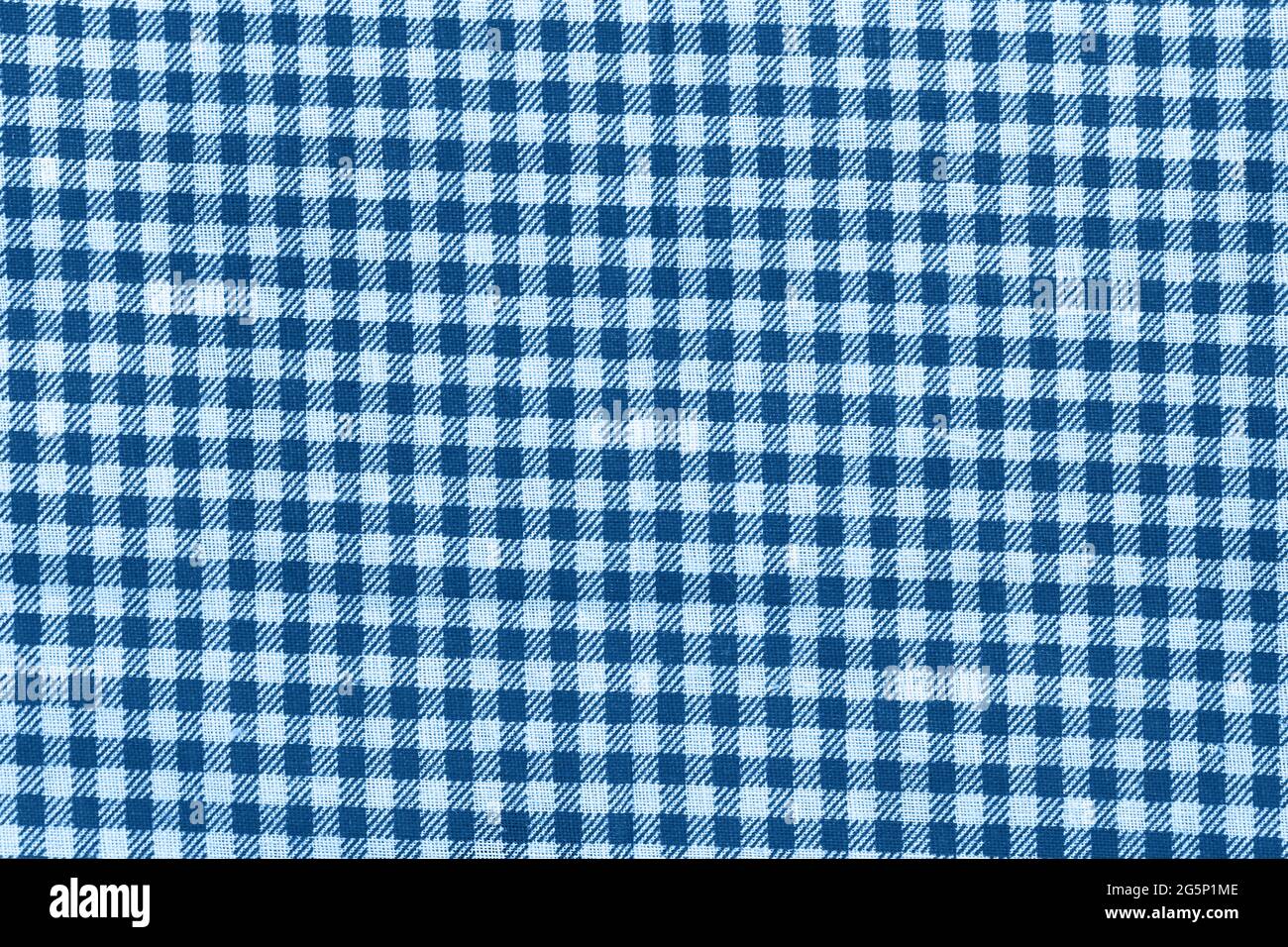 Classic blue and white checkered fabric texture. Bright colored cotton ...