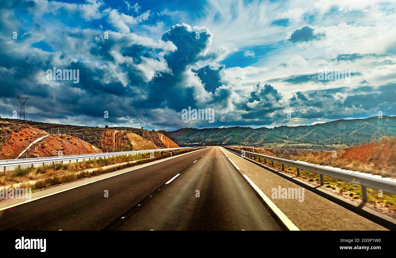 Picturesque road landscape scene and sunrise above road.Empty asphalt ...