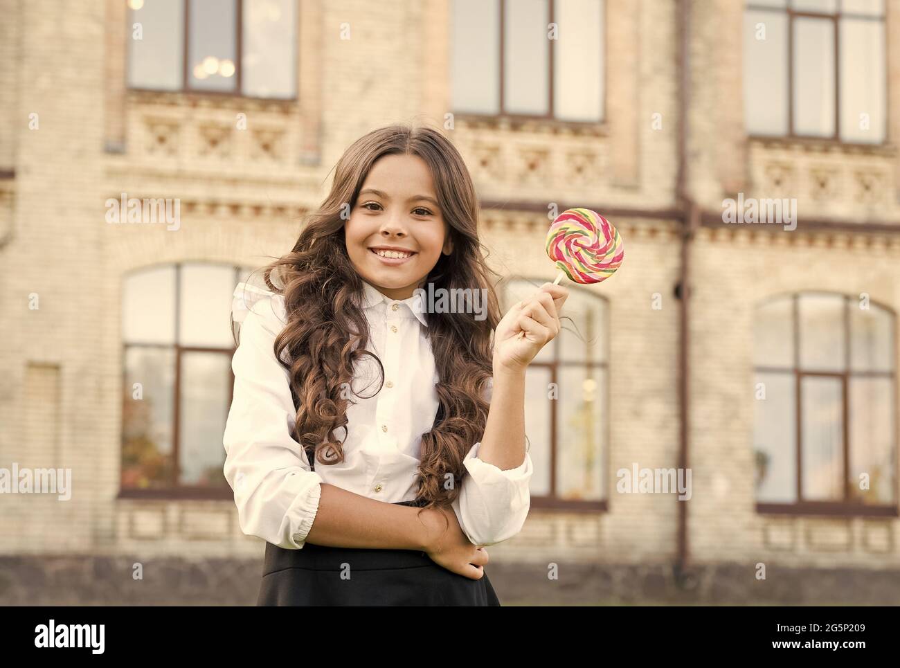 Schoolgirl relaxing. School nutrition. Sugar diet. Sweet joy. Happy kid ...