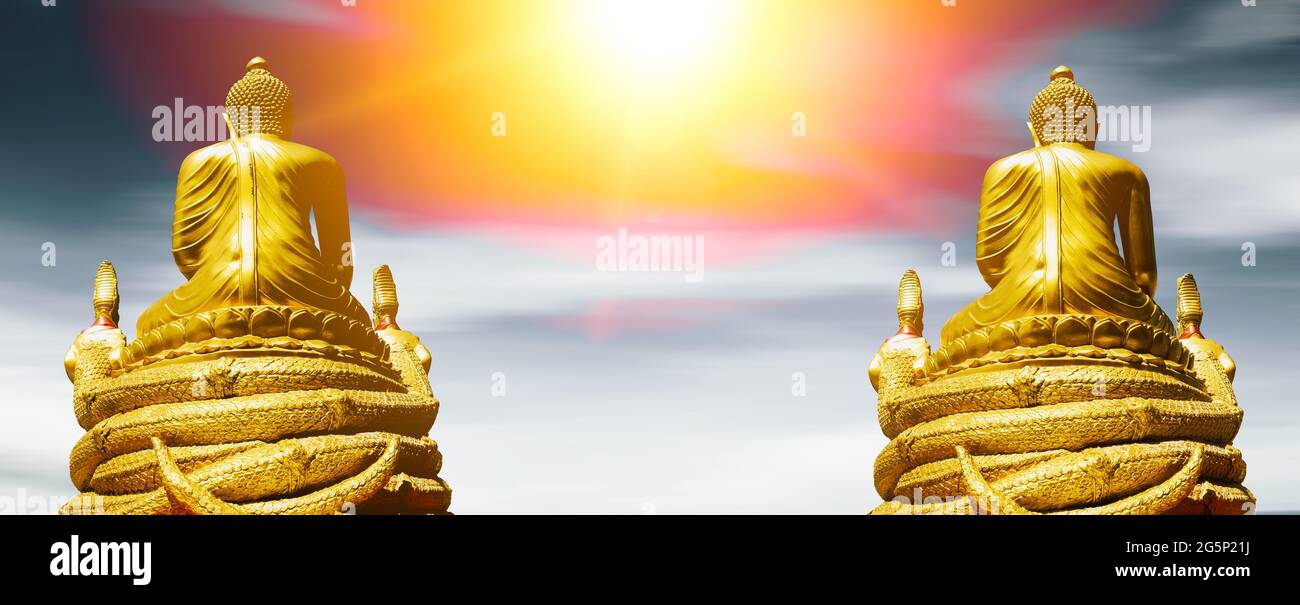 Statue of two golden Buddhas sitting in meditation position. Buddhism ...