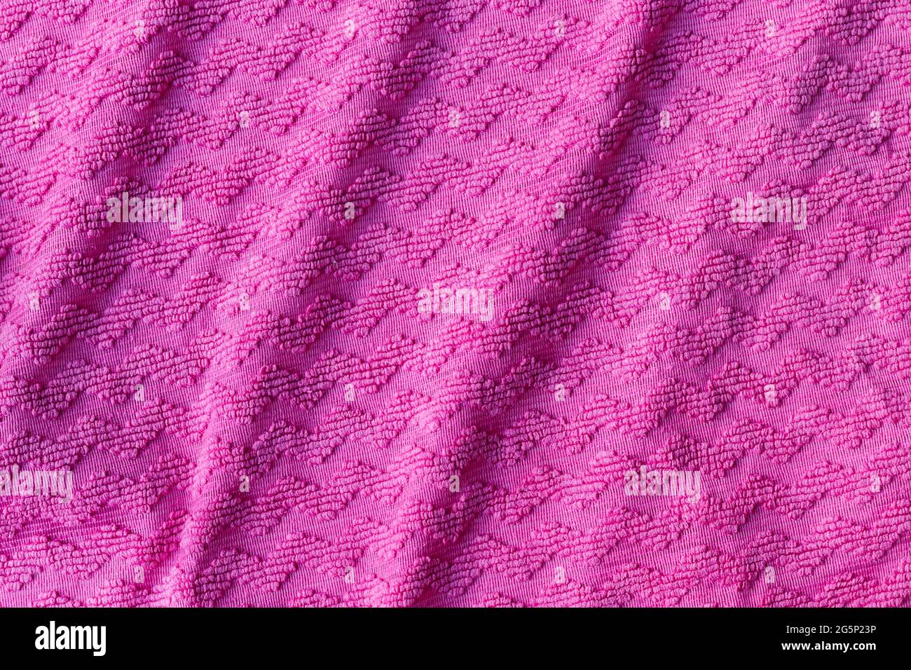 Bright pink fabric texture with zigzag pattern. Crumpled rough textile ...