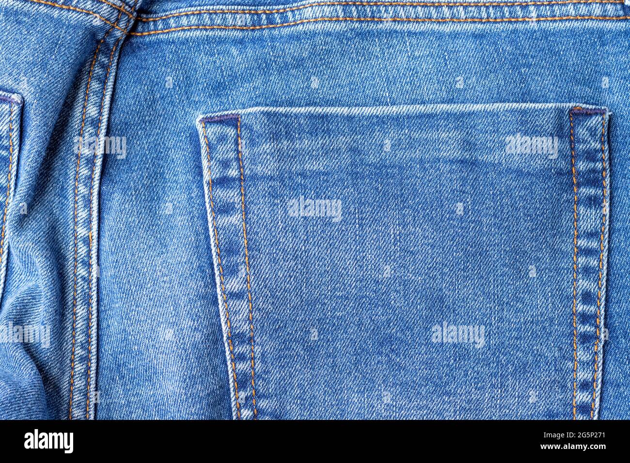 Bright blue jeans fabric texture. Denim background with back pocket ...
