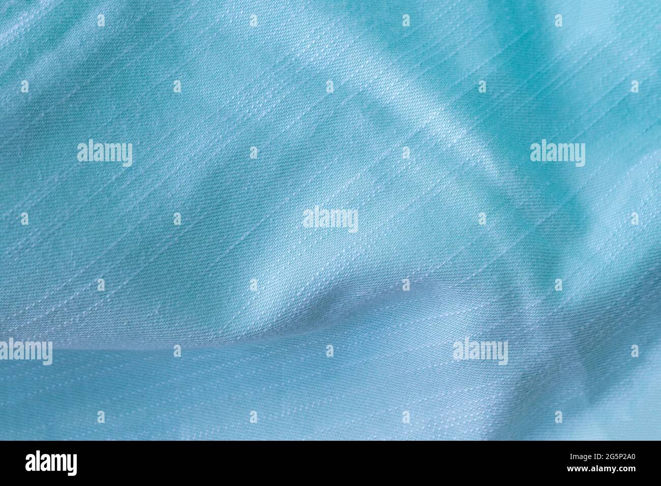 Soft blue, turquoise crumpled cotton fabric texture background with ...